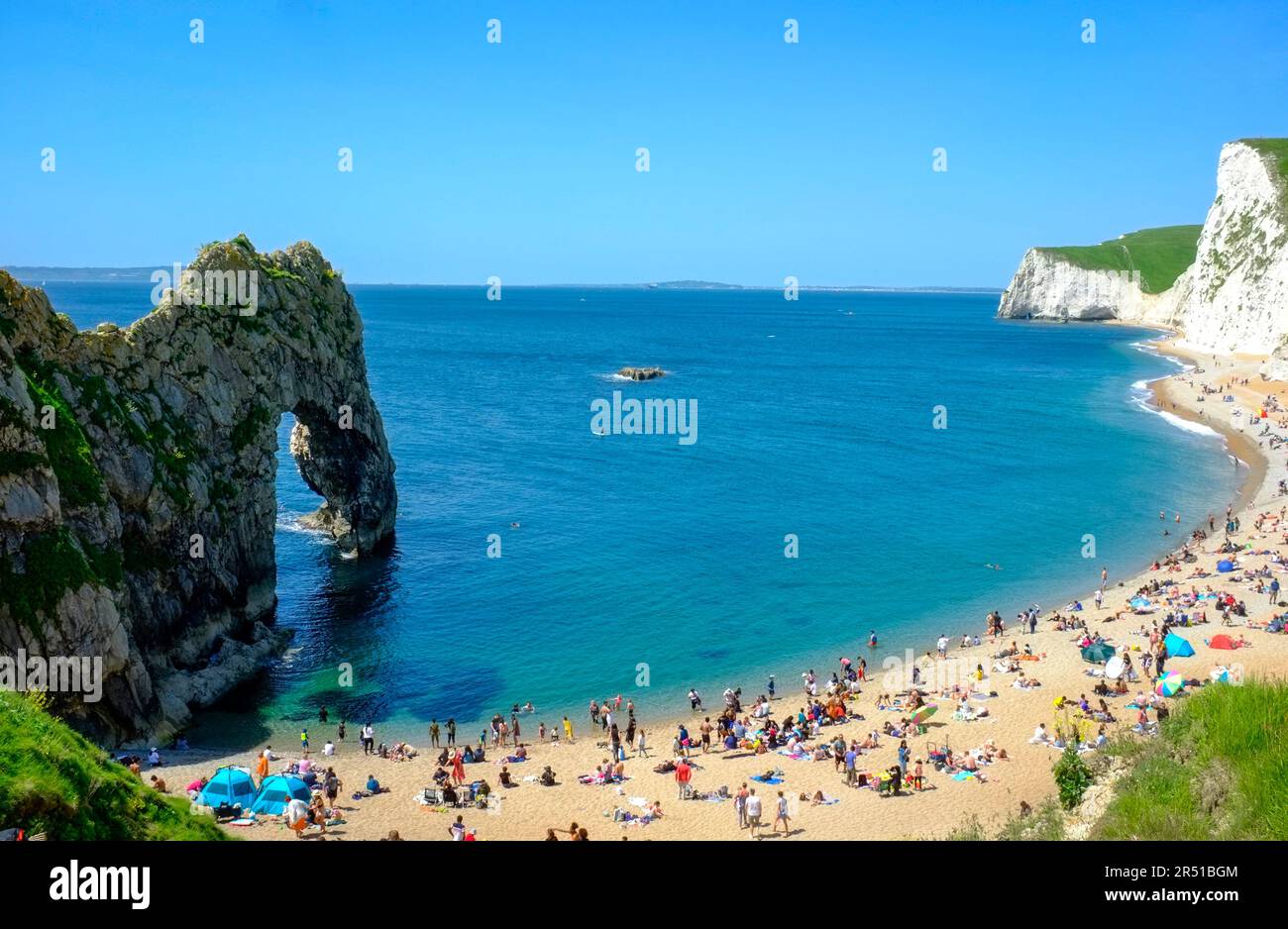 Durdle Door, a natural limestone arch on the Jurassic Coast near ...