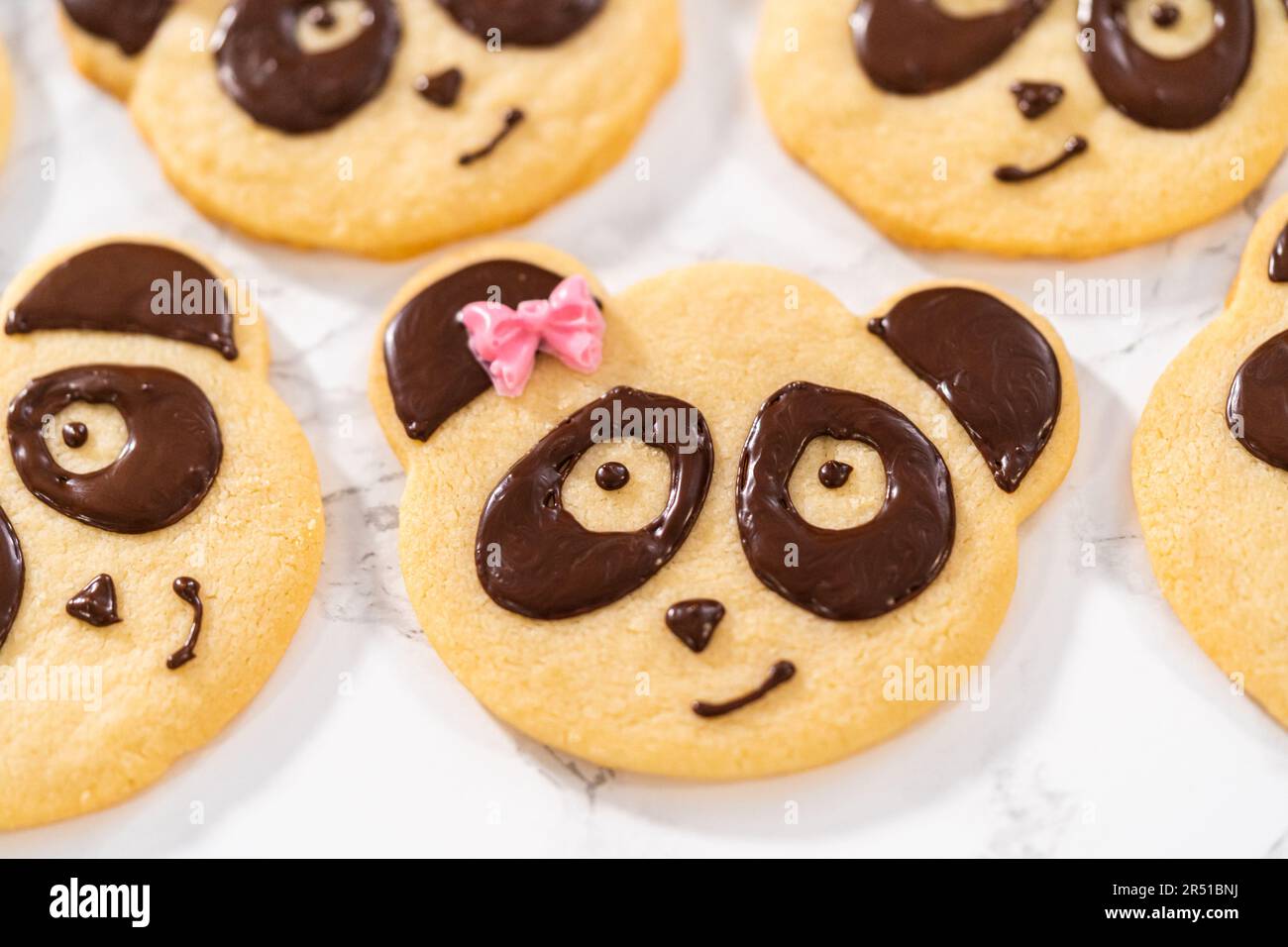 Panda shaped shortbread cookies with chocolate icing Stock Photo - Alamy
