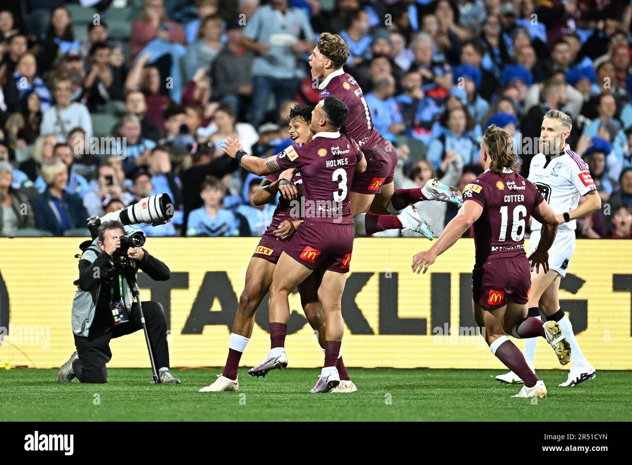 Selwyn Cobbo of the Maroons celebrates his try with Reece Walsh and ...