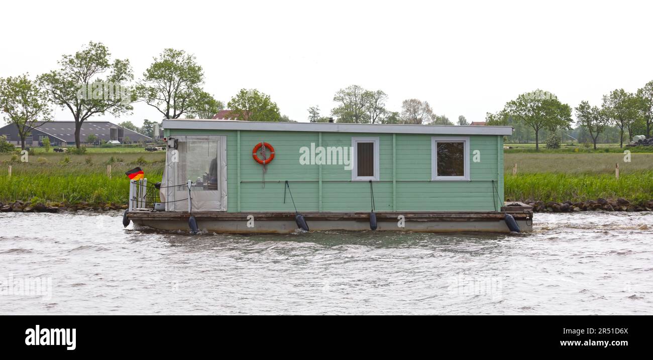 Houseboat on the move in the Netherlands, canal Stock Photo - Alamy