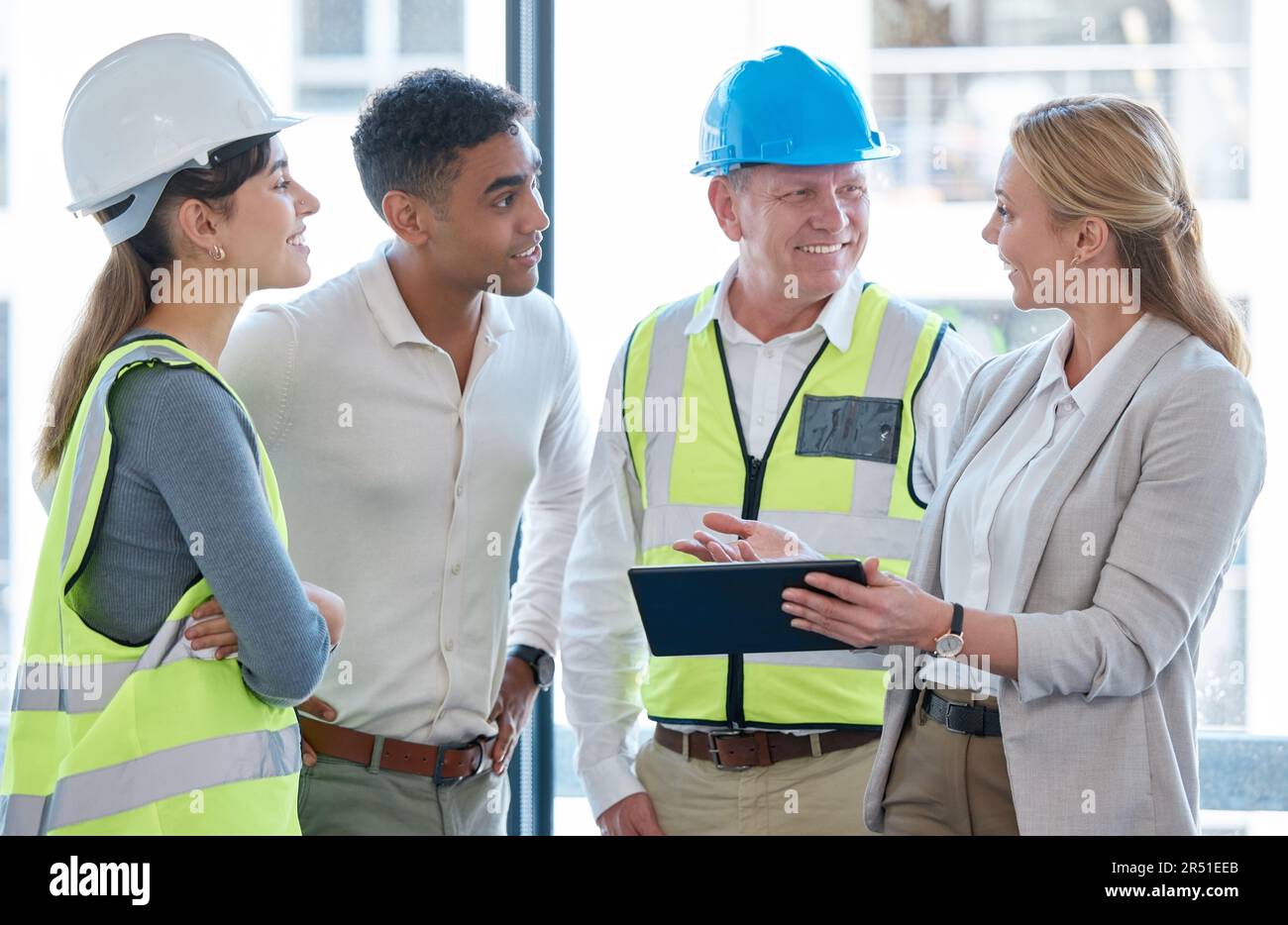 Tablet, engineering and group of people talking, planning and project ...