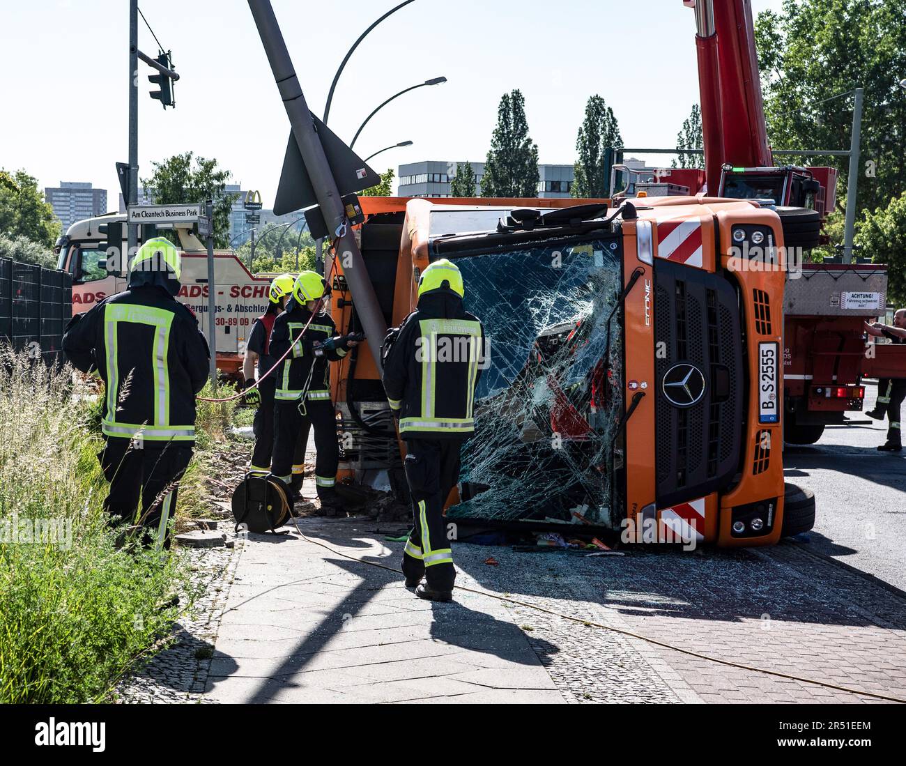 Berlin, Germany. 31st May, 2023. Firefighters stand by an overturned ...