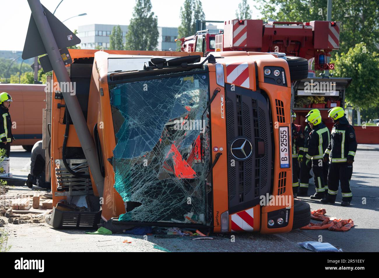 Berlin, Germany. 31st May, 2023. Firefighters stand by an overturned ...