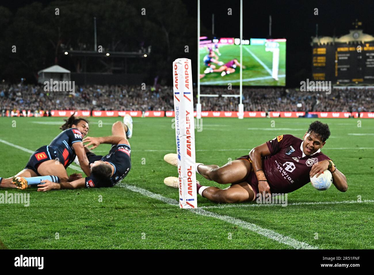 Adelaide, Australia. 31st May, 2023. Selwyn Cobbo of the Maroons scores ...