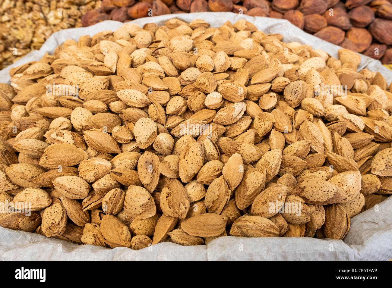 Pile of almond pits in an Asian market Stock Photo - Alamy