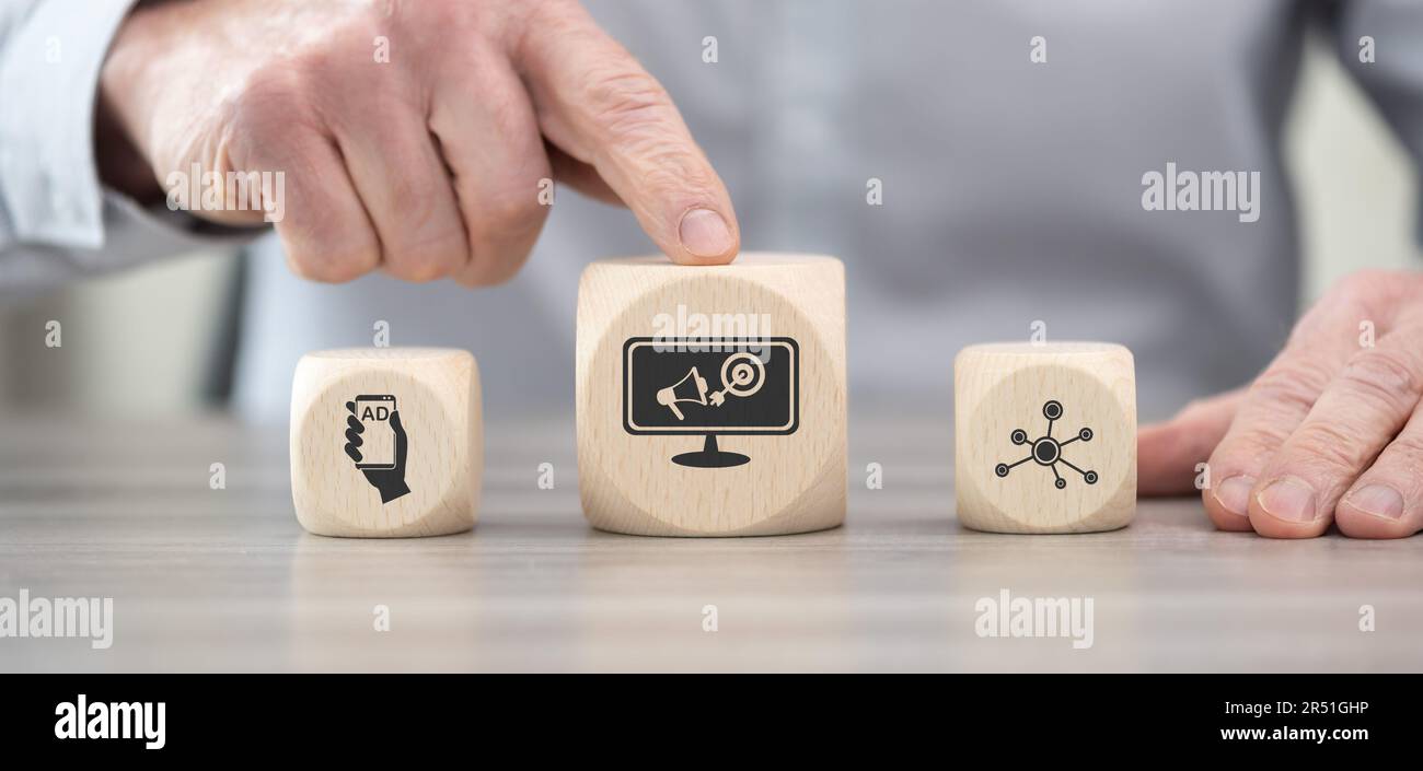 Wooden blocks with symbol of ad targeting concept Stock Photo - Alamy