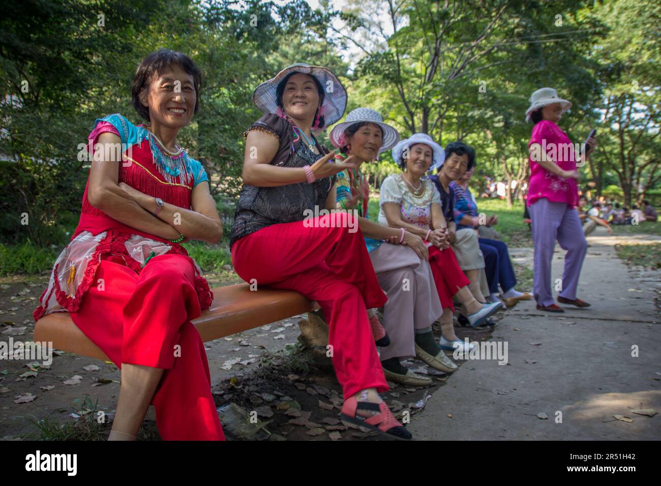 north korean people dancing in a park in Pyongyang during celebration ...