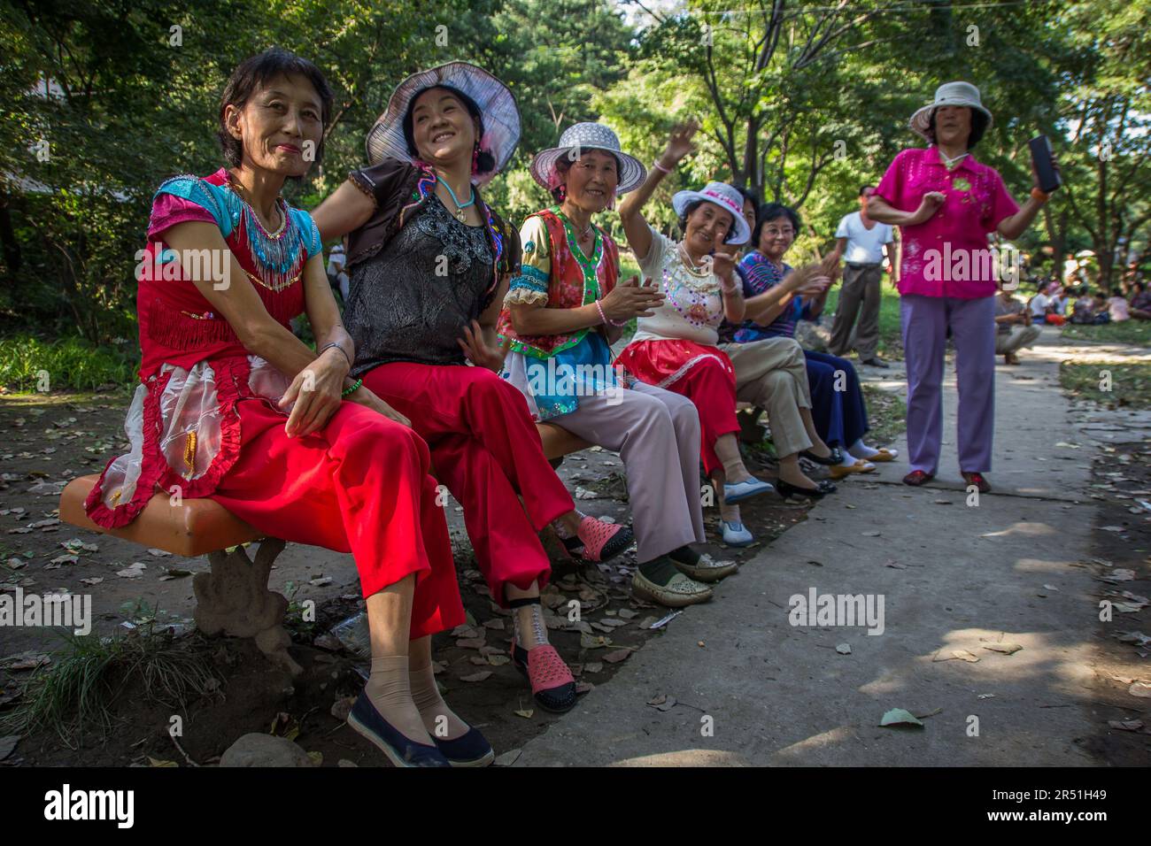 north korean people dancing in a park in Pyongyang during celebration ...