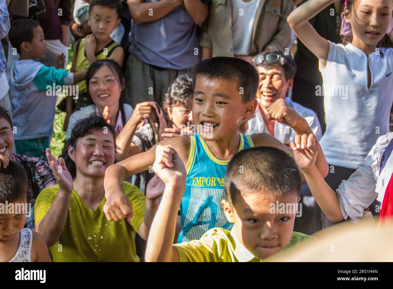 north korean people dancing in a park in Pyongyang during celebration ...