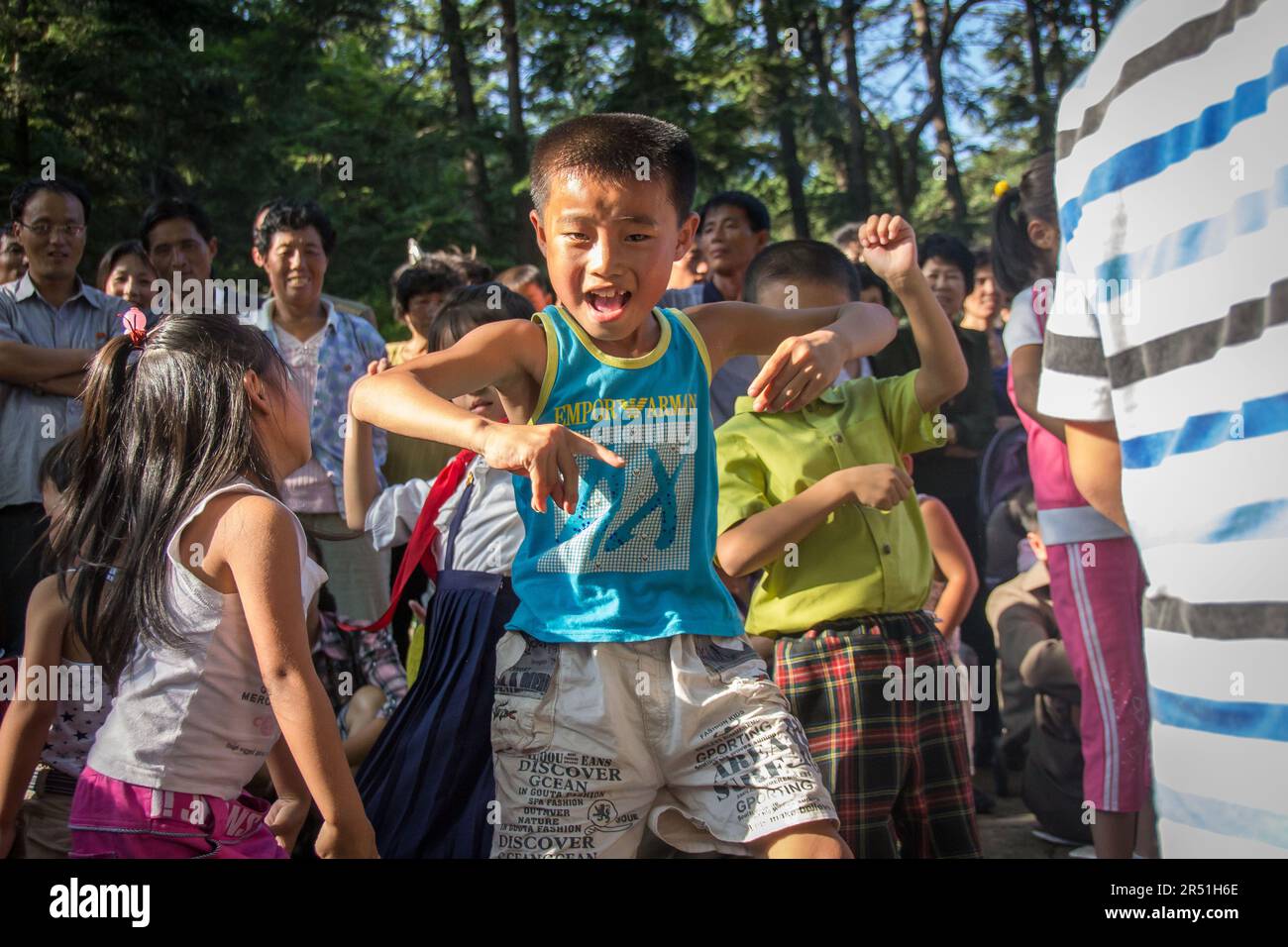 north korean people dancing in a park in Pyongyang during celebration ...