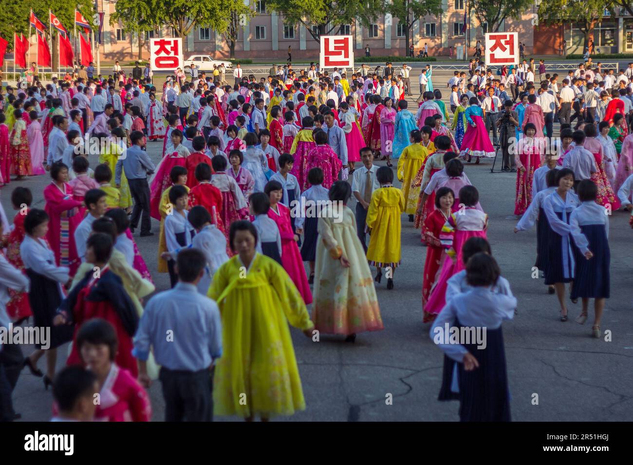 Mass dance in the streets on Pyongyang, North Korea Stock Photo - Alamy