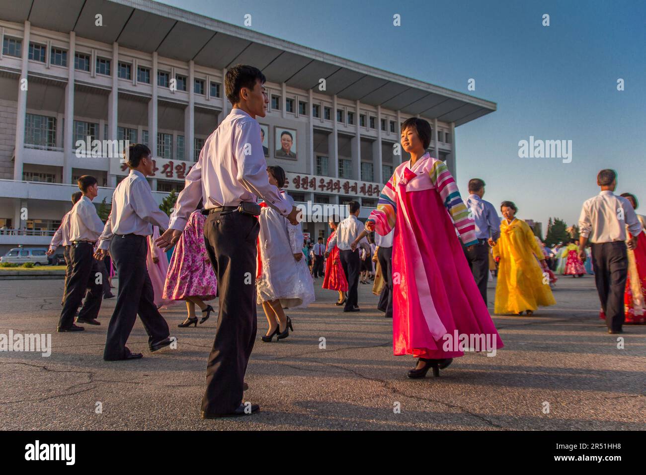 Mass dance in the streets on Pyongyang, North Korea Stock Photo - Alamy