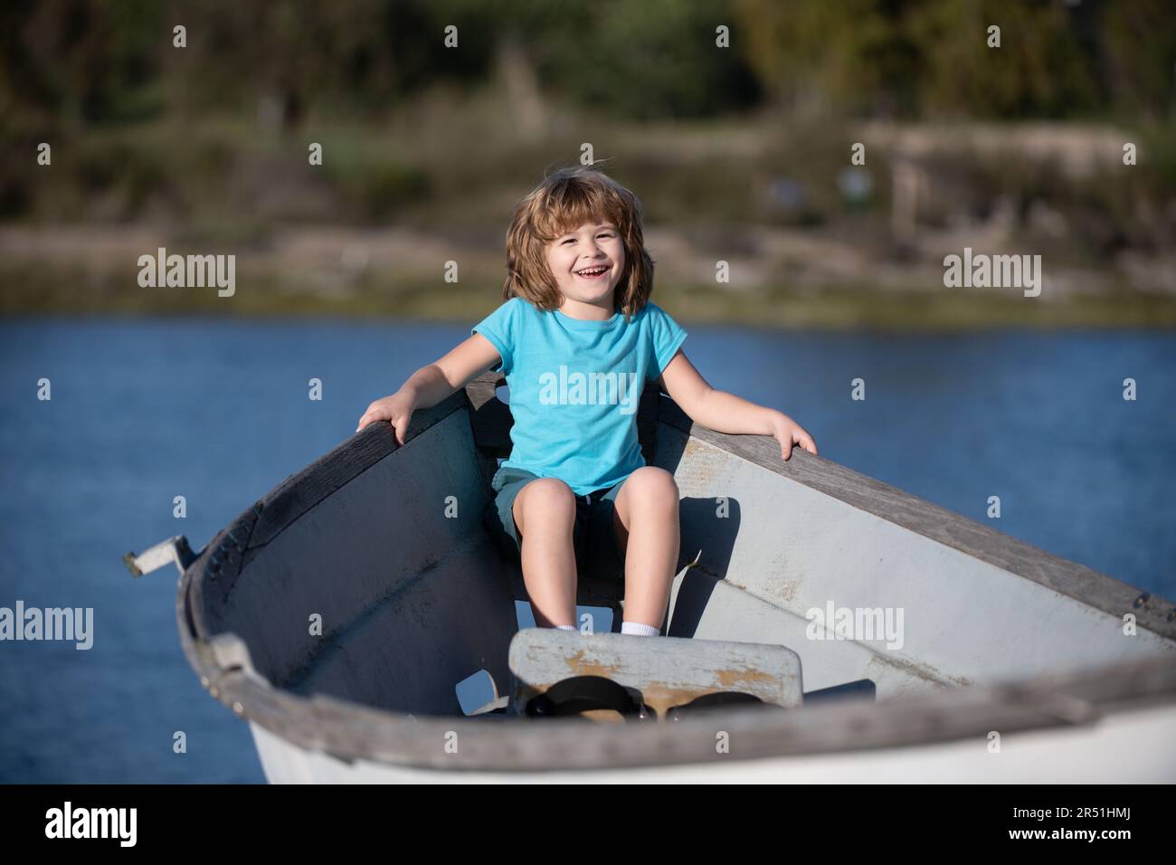 Lifestyle closeup portrait of funny kids face outdoors. Summer kid ...