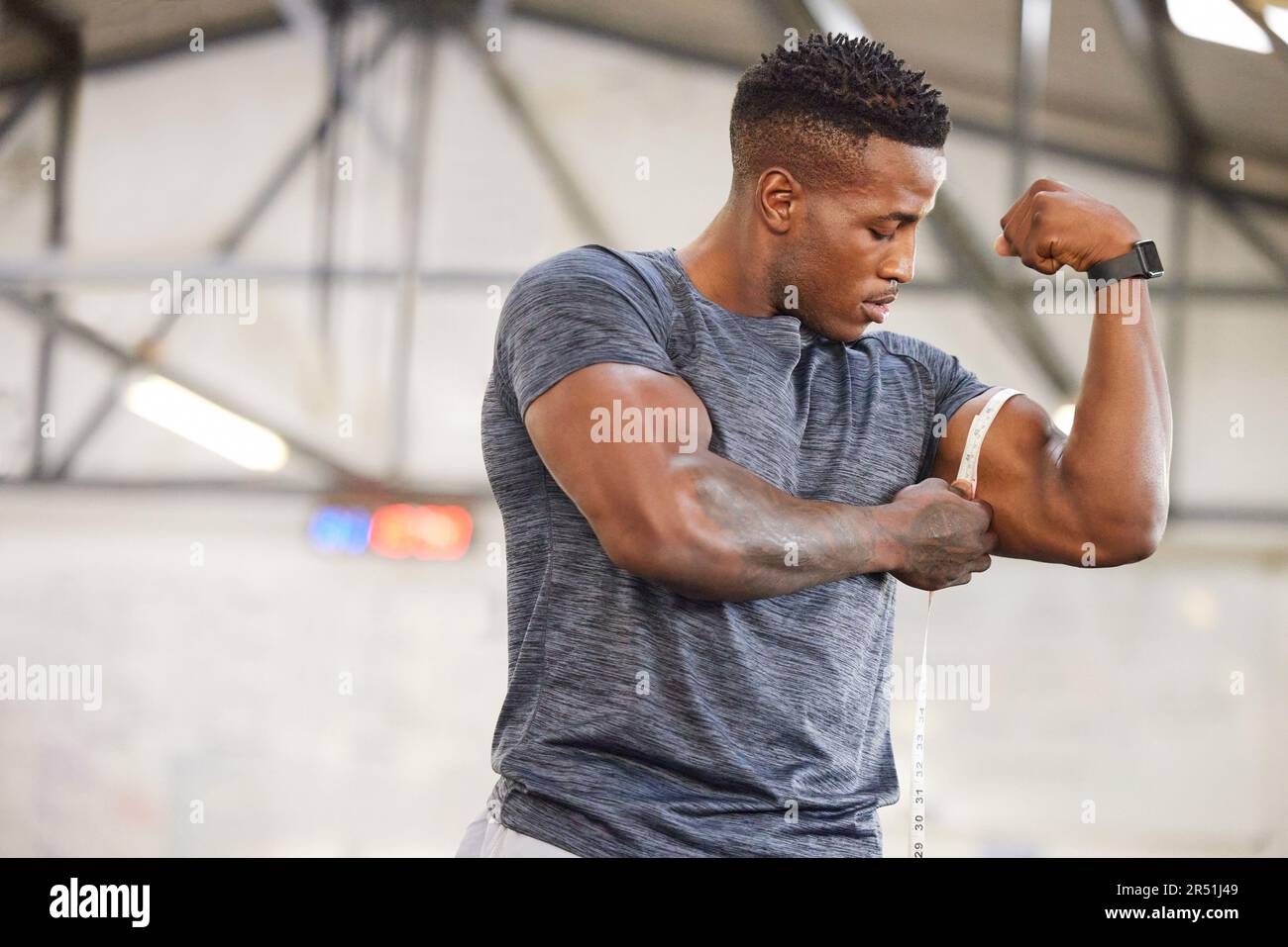 Black man, tape measure and bicep with muscle and strong athlete ...