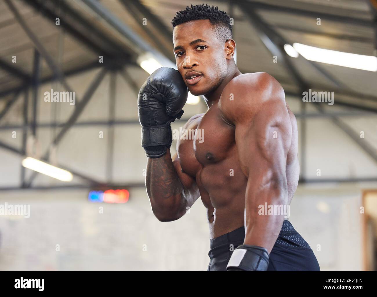 African man, boxing and punching in portrait for fitness, focus or ...