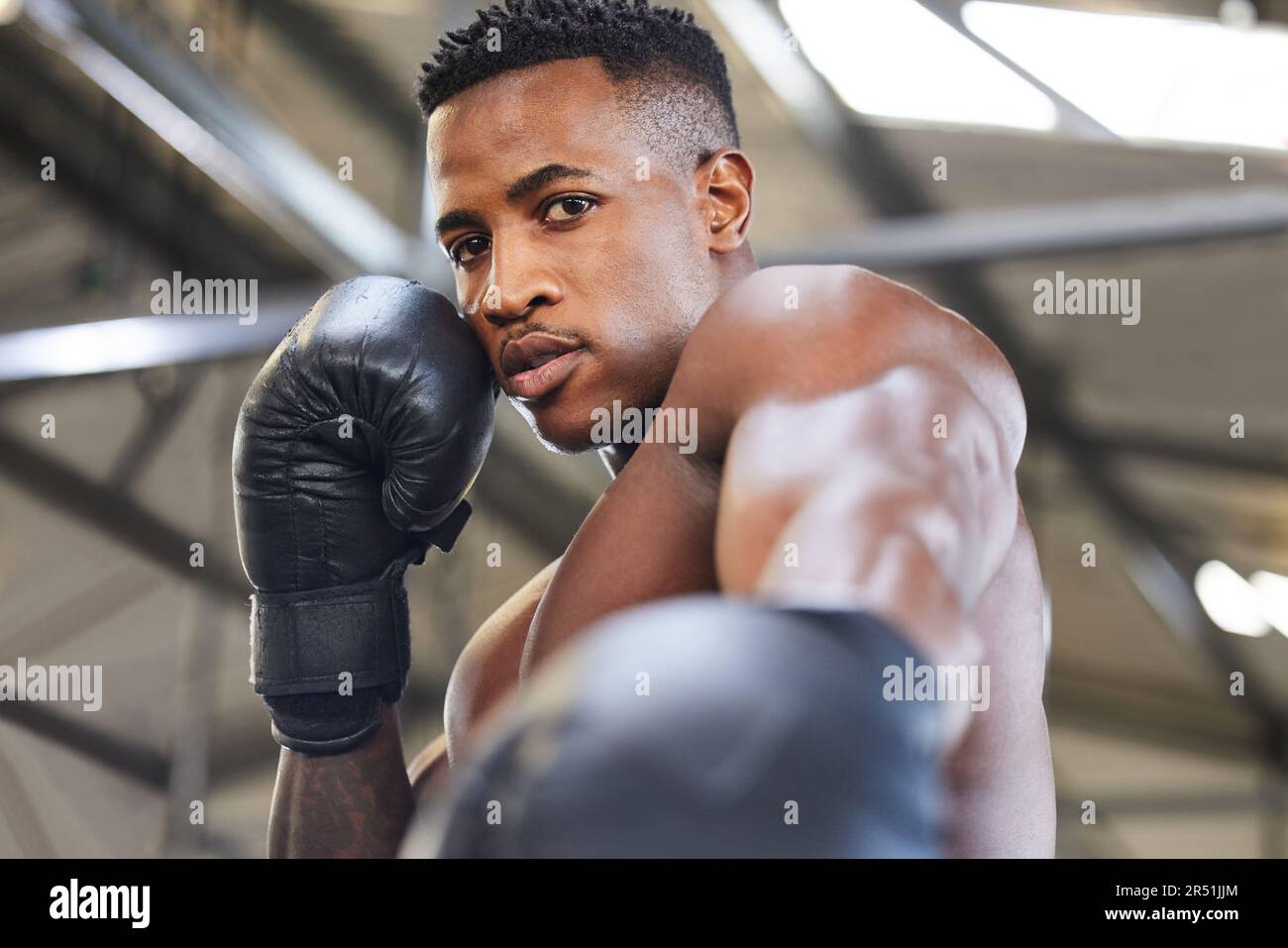 African man, boxing and punch in portrait for fitness, focus or ...