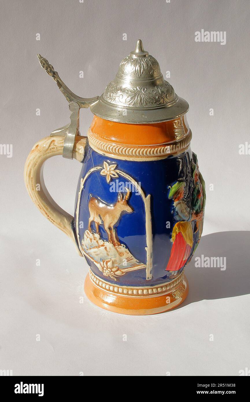 The photograph beautifully decorated traditional German mug for beer ...