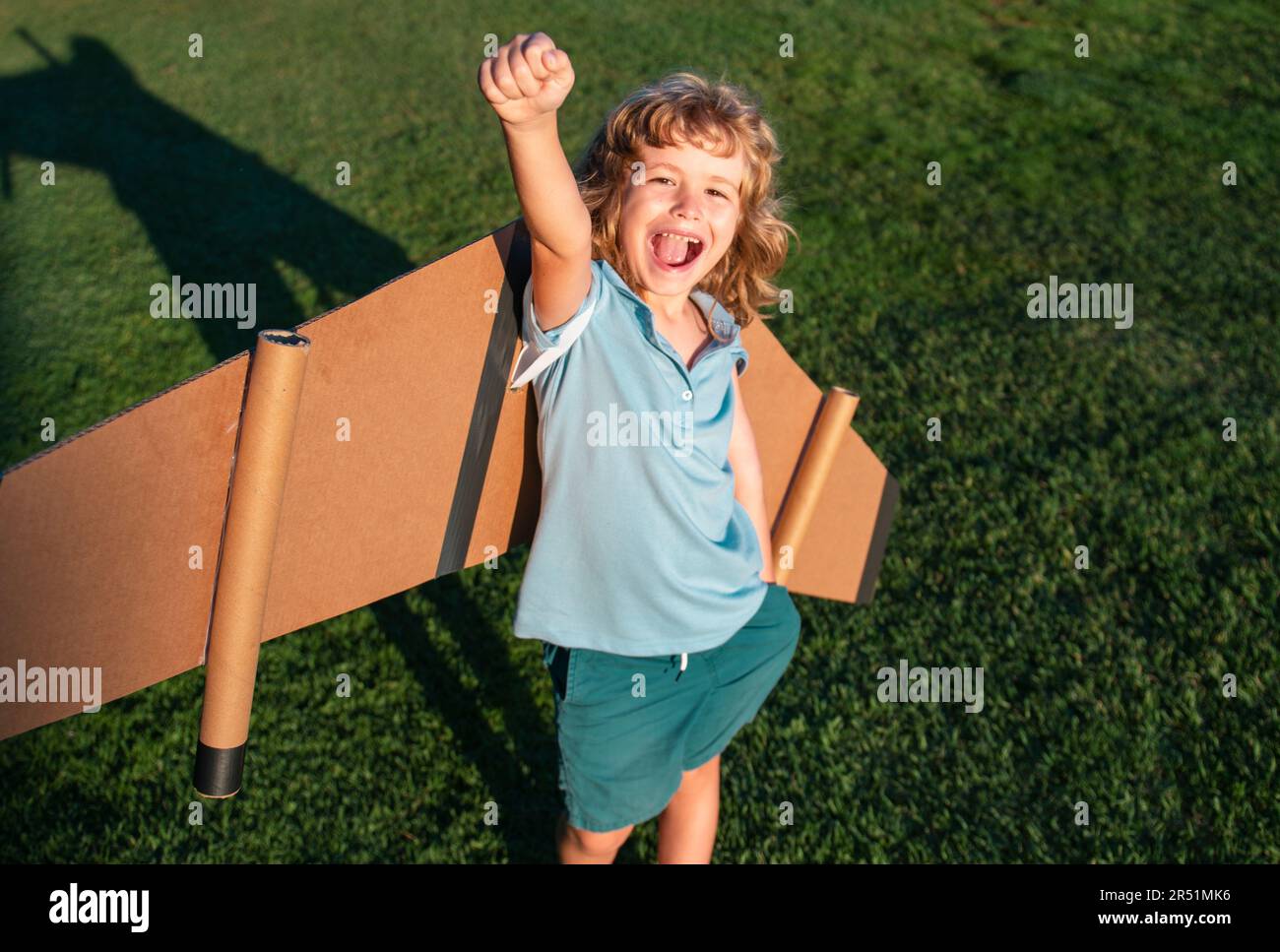 Excited kid boy leader and winner, success start up. Kid dreams of ...