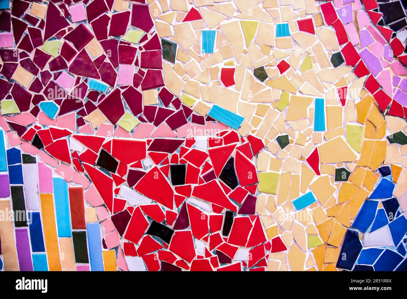 Colorful mosaic from broken tile and stone decorating on the wall for ...