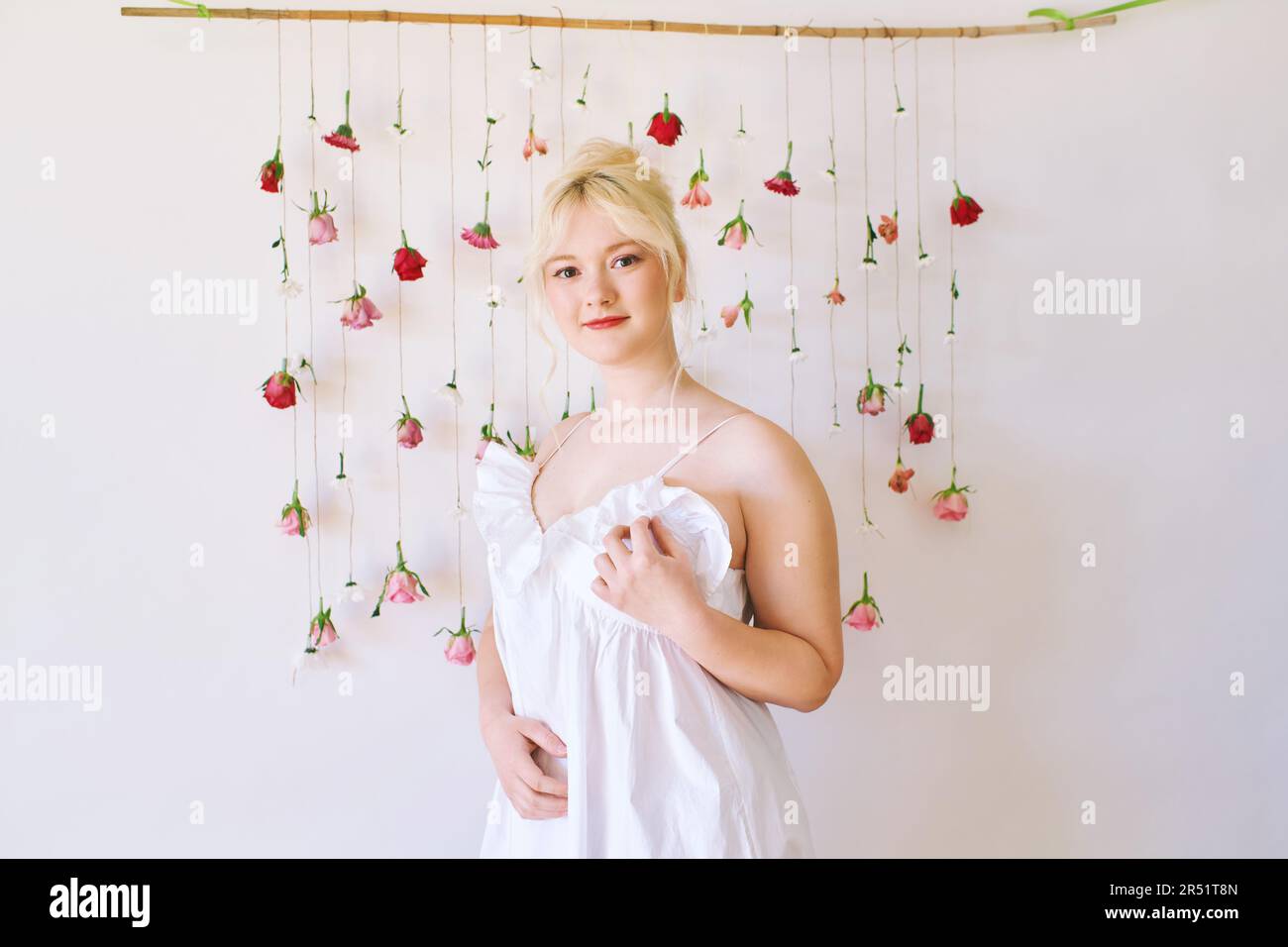 Studio portrait of pretty young teenage 15 - 16 year old girl wearing ...
