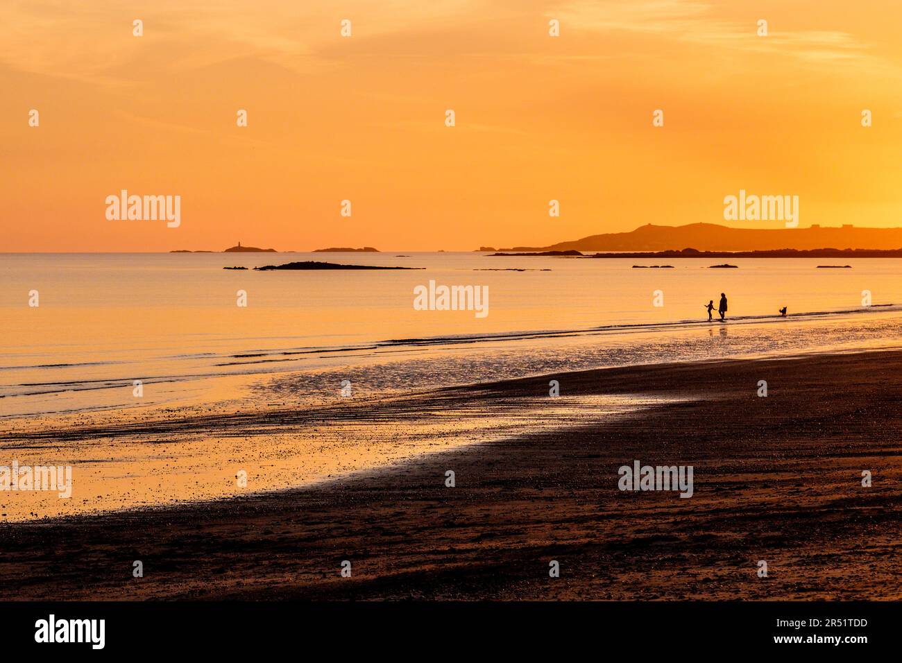 Sunset on Rhosneigr beach, Anglesey, Wales, UK Stock Photo - Alamy