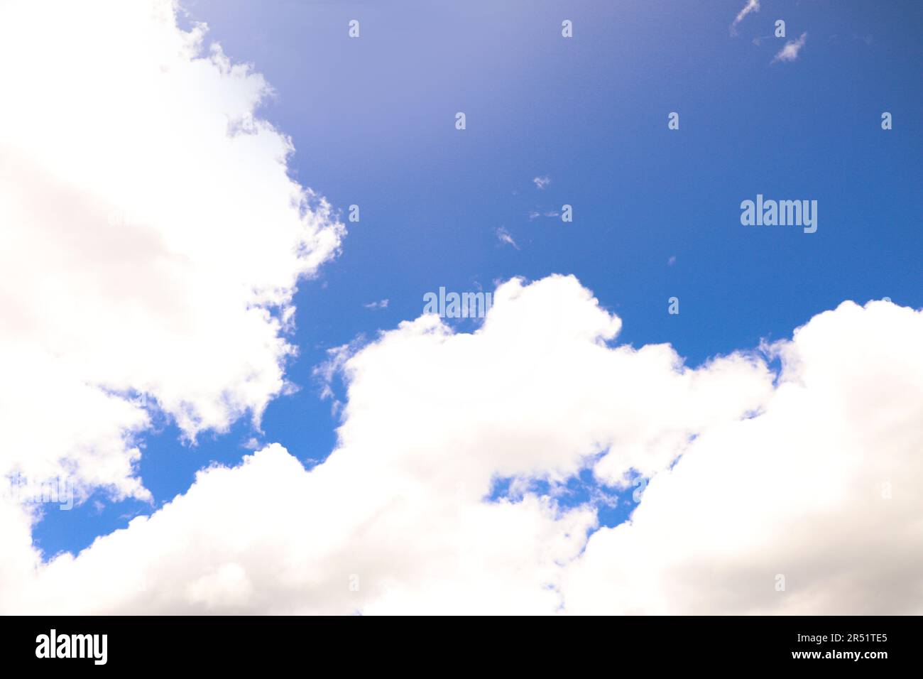 Bright Blue Sky with Solid White Clouds Stock Photo - Alamy