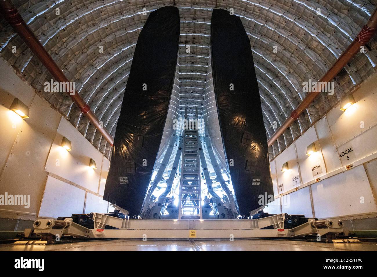 Boeing's Dreamlifter transports the wings of a 787 inside its main body ...