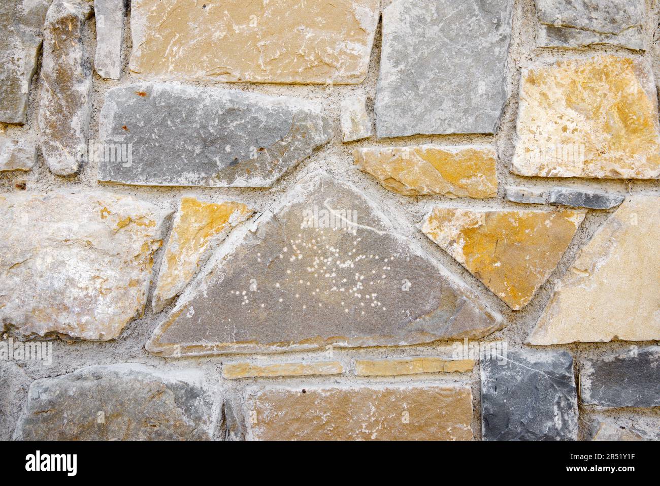 Texture of an old stone wall in Spain Stock Photo - Alamy