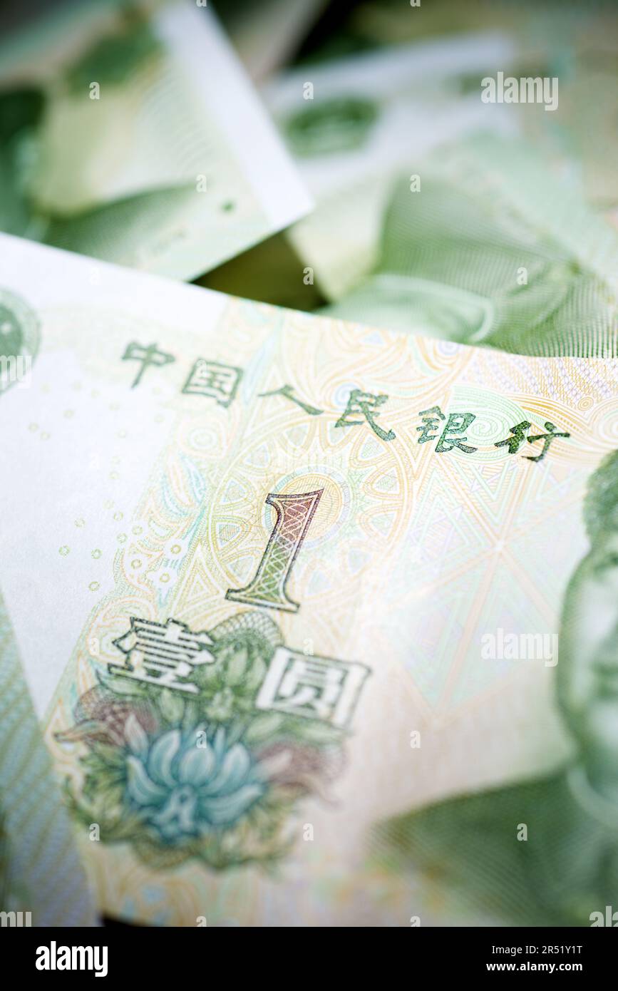 Closeup of a group of one yuan banknotes with the portrait of Mao Tse ...