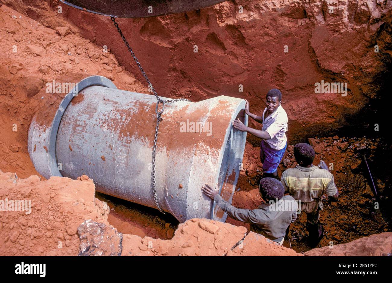 Mozambique, Maputo; Men working on the (re)construction of the sewer ...