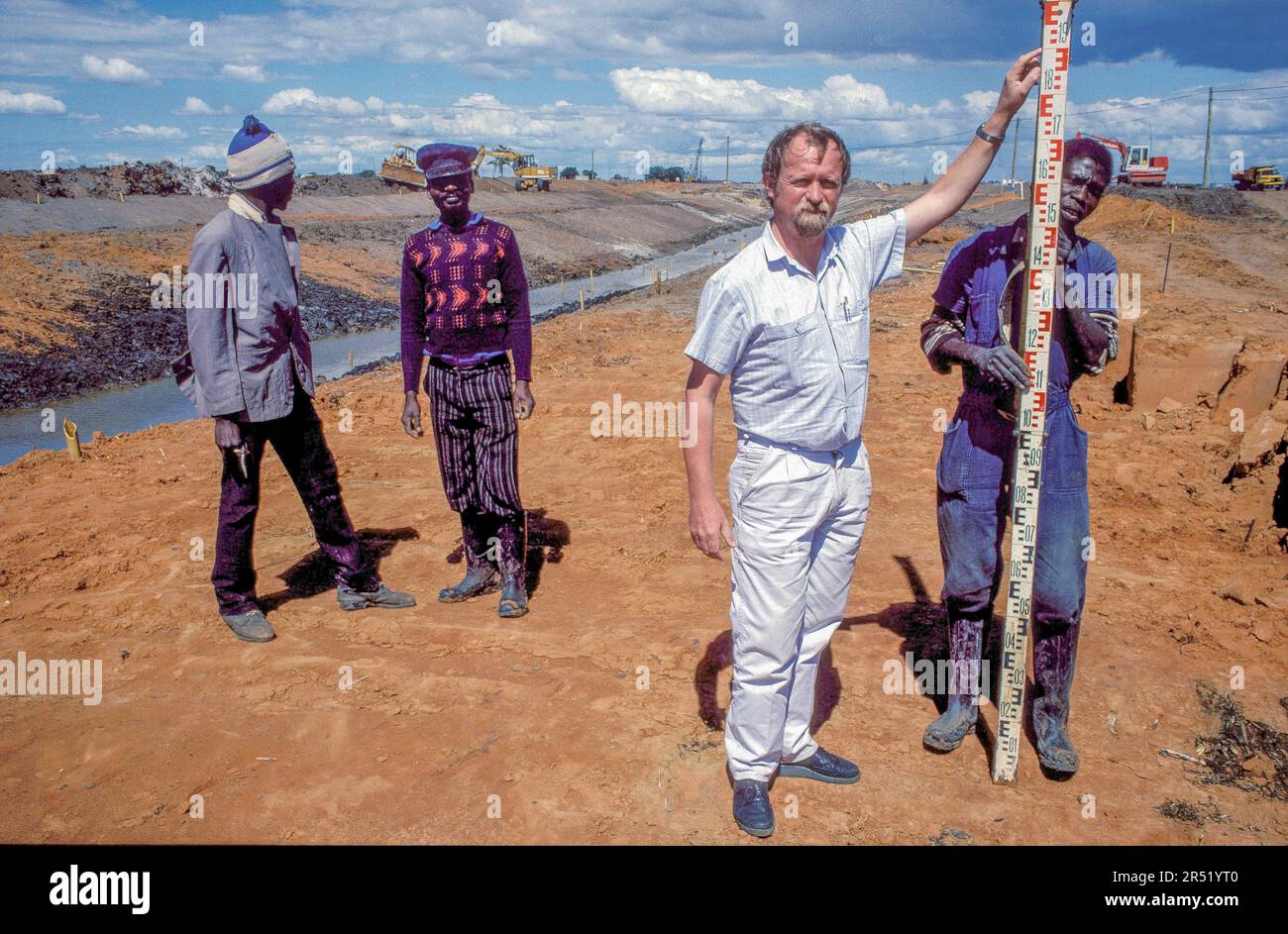 Mozambique, Maputo; Dutch expat and local worker surveying land. At the ...