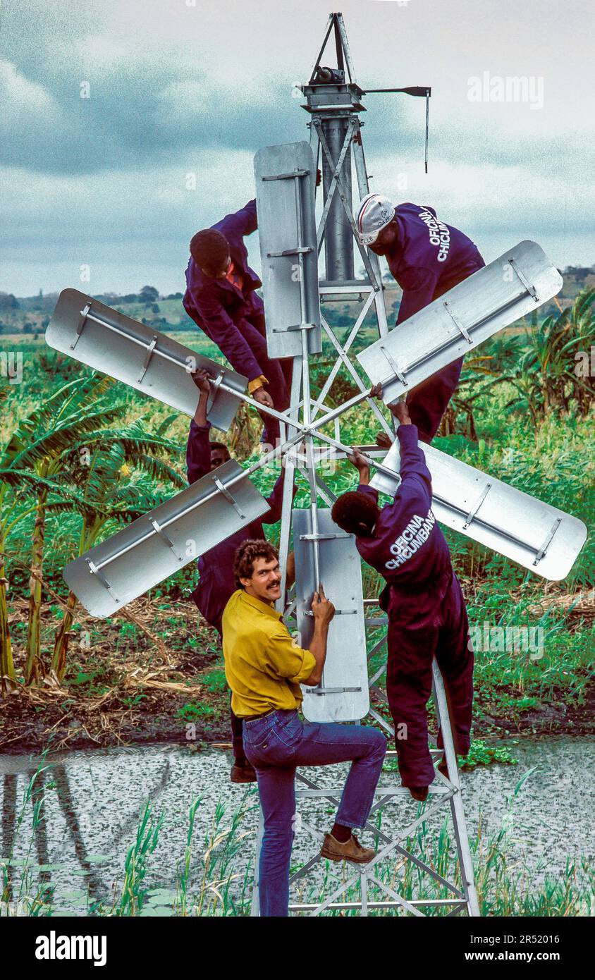 Mozambique, Xai-Xai region; Locals and an expat are installing a wind ...