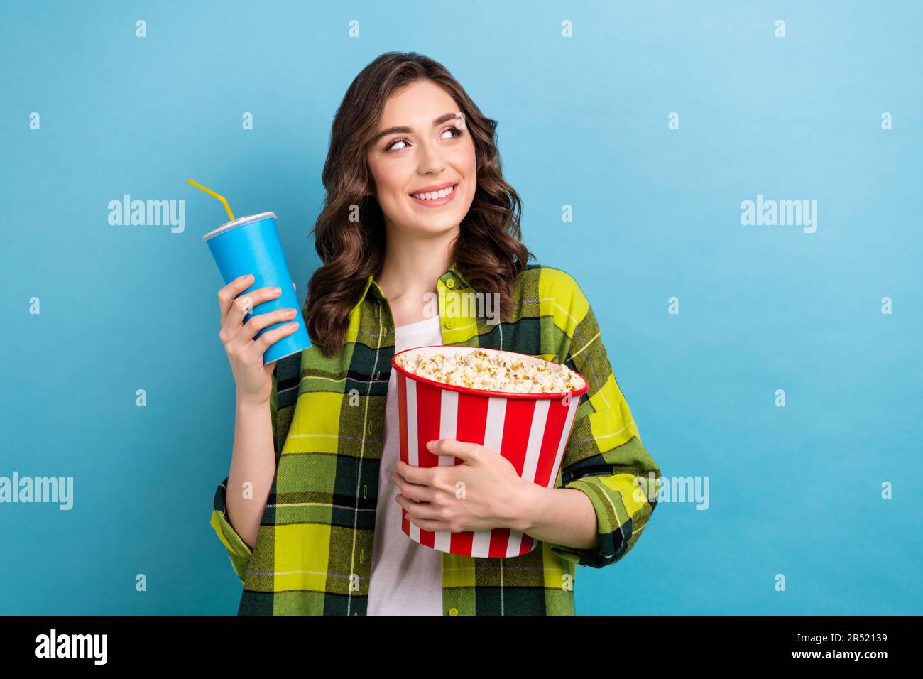 Photo of dreamy cute lady wear checkered jacket eating pop corn ...