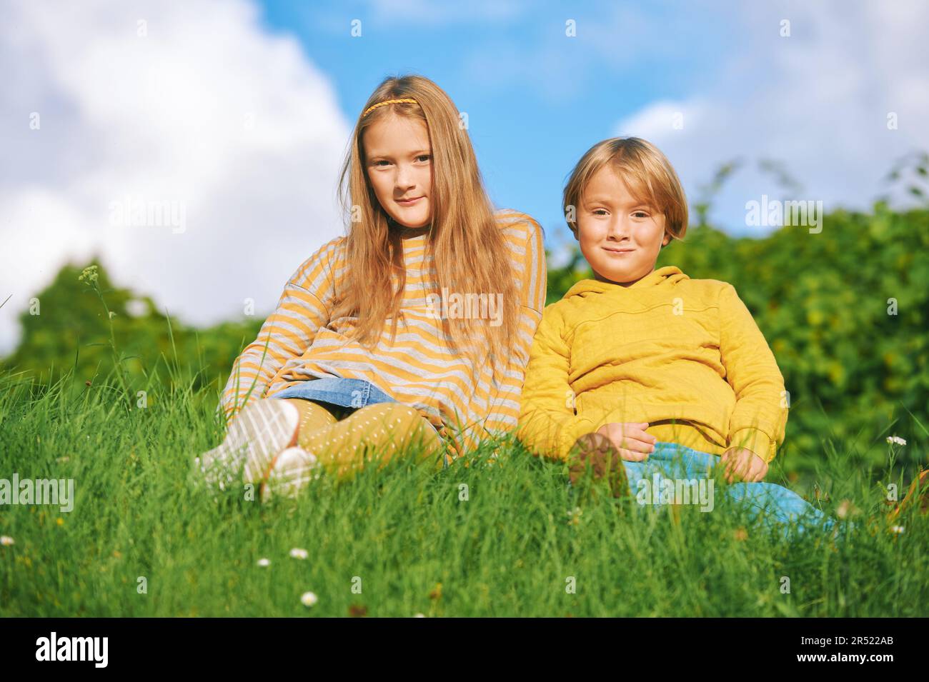 Portrait of 2 funny children playing together outside Stock Photo - Alamy
