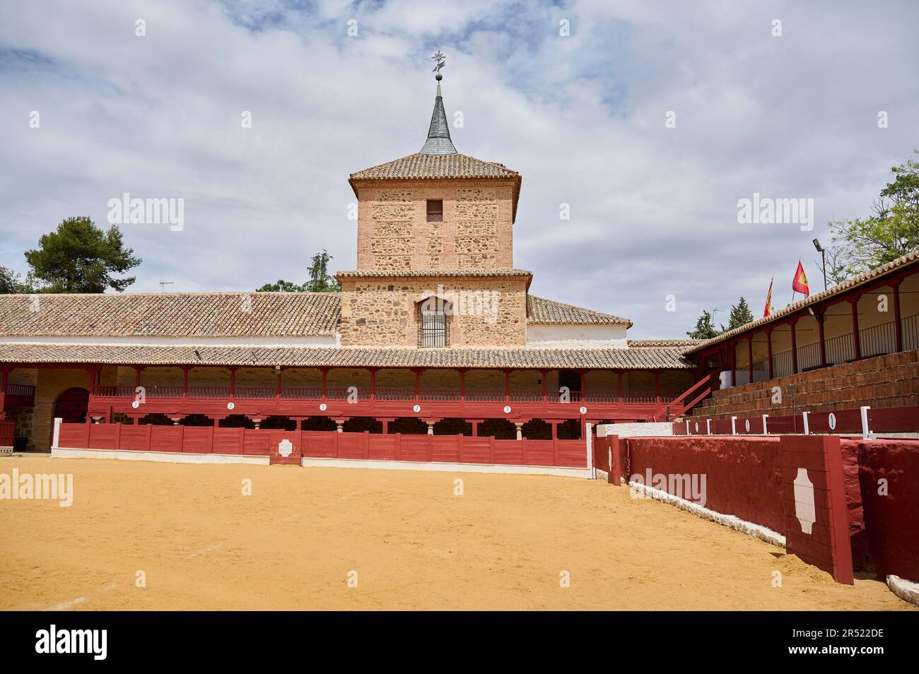 Ancient bullring enclosed with barricades of red walls and spectator ...