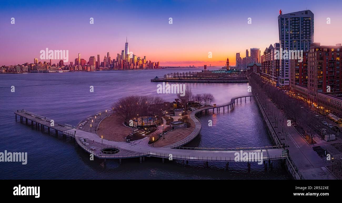 NYC NJ Skylines - Aerial view during sunset of Pier C, the iconic ...