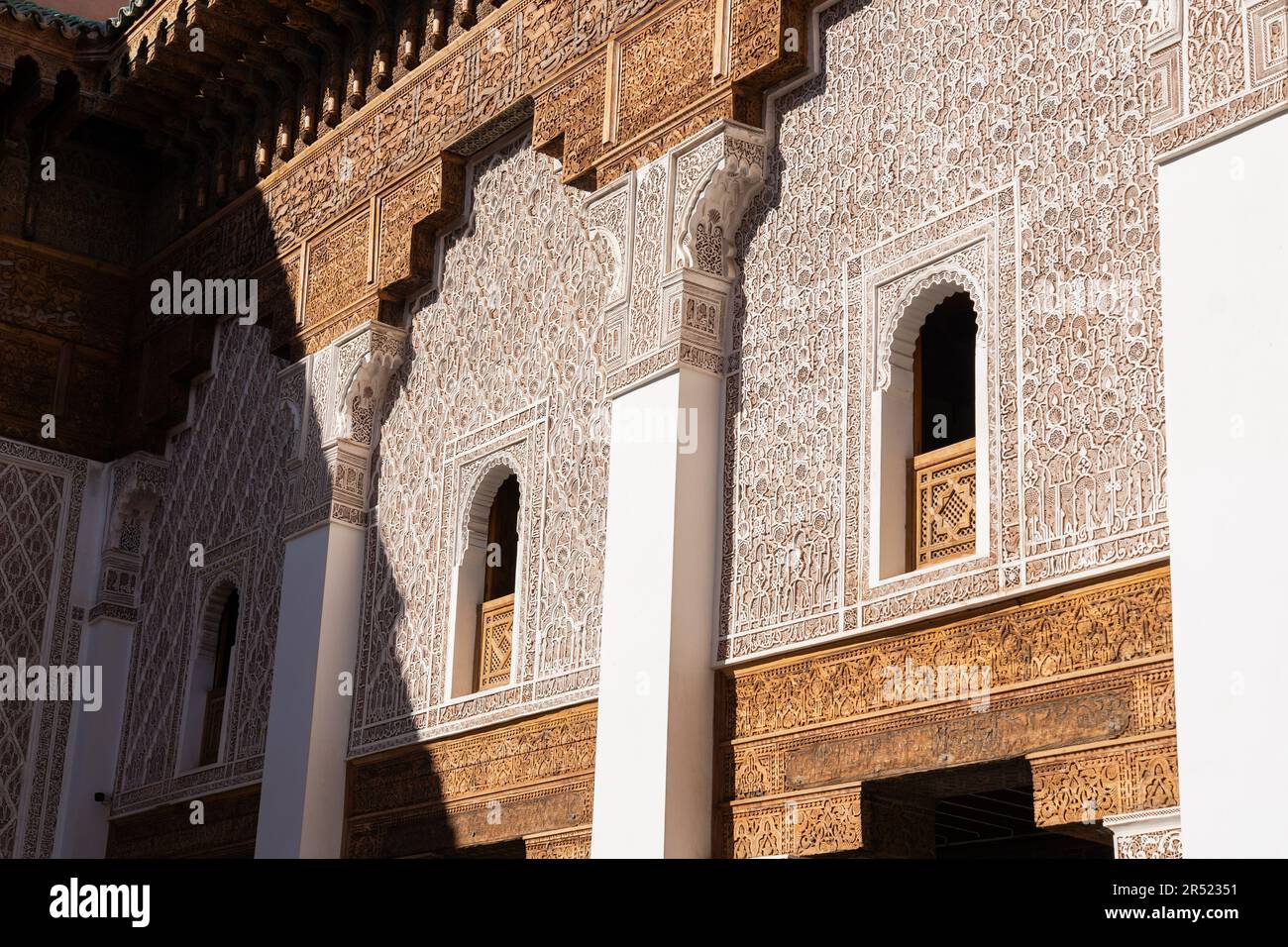 Majestic ornamental facade of ancient building with arched windows and ...