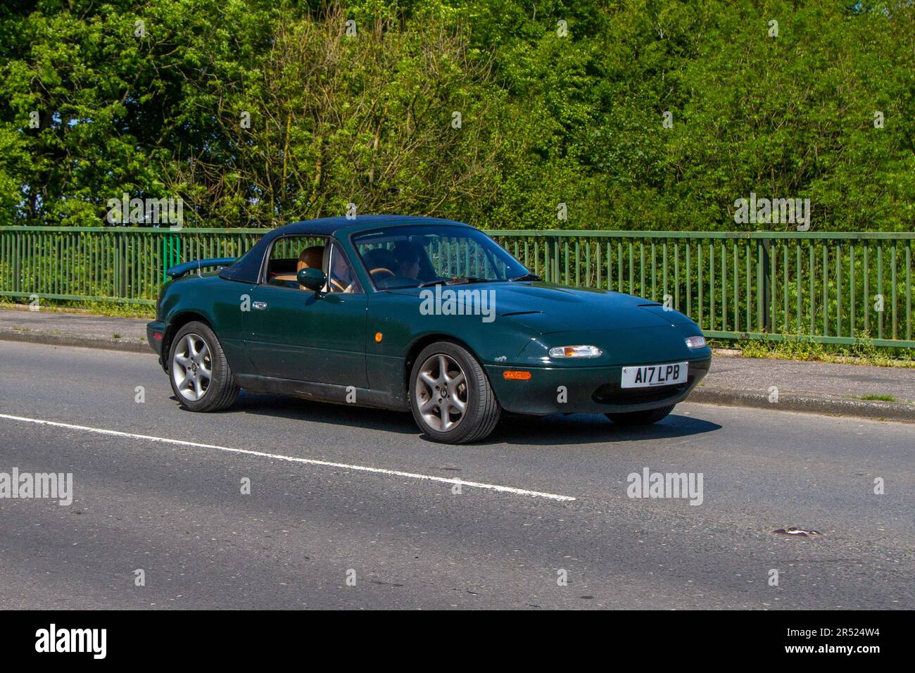 1991 90s nineties Green Mazda Mx-5 crossing motorway bridge in Greater ...