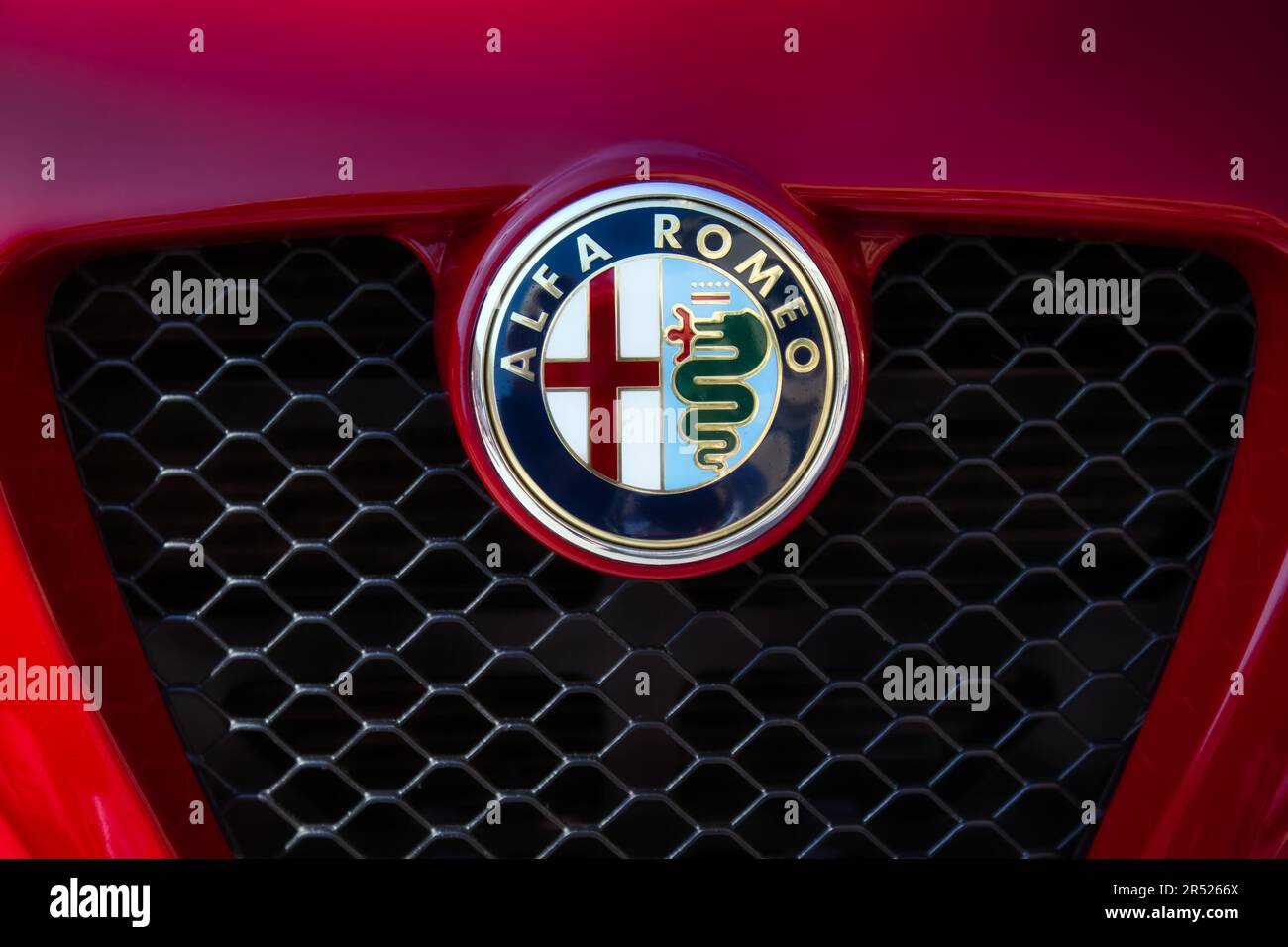 Close-up shot of the Alfa Romeo brand logo on the front radiator grille ...