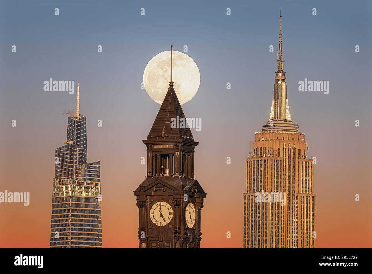 The full moon rises behind the Lackawanna Clock Tower in Hoboken, New ...