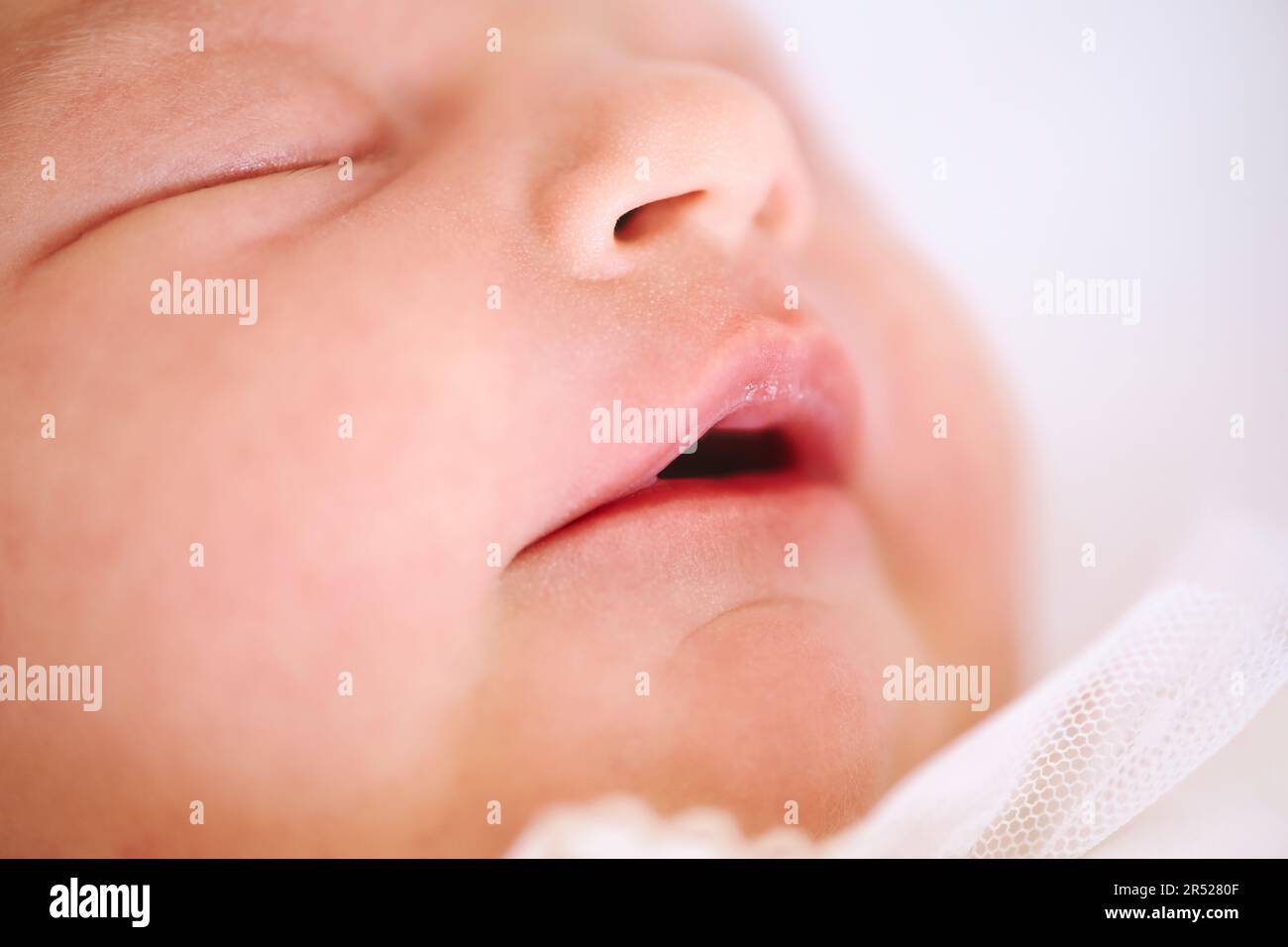 Close up image of newborn baby face Stock Photo - Alamy