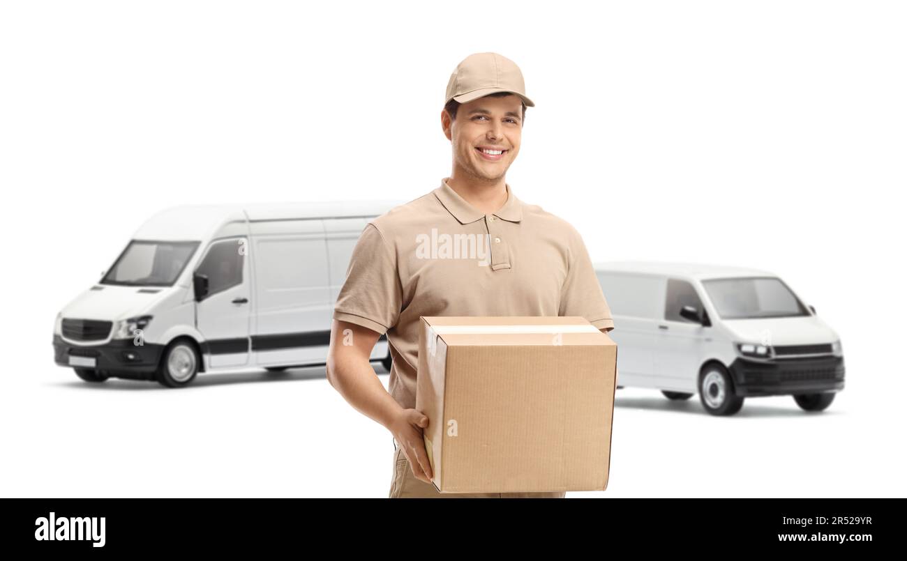 Delivery guy holding a package and standing in front of transport vans ...