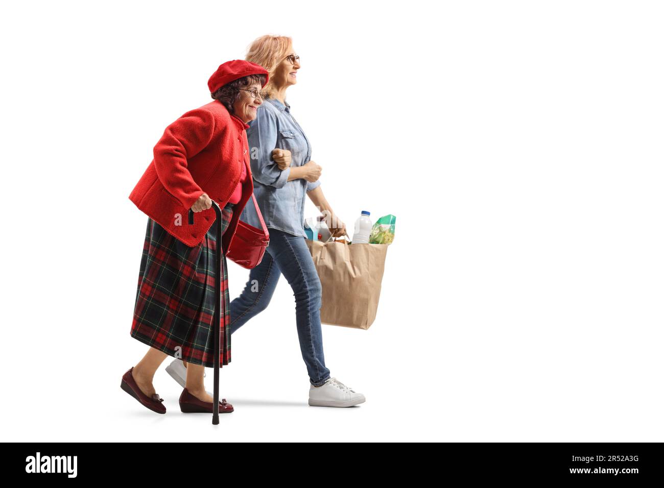 Helping senior carry bags Cut Out Stock Images & Pictures - Alamy