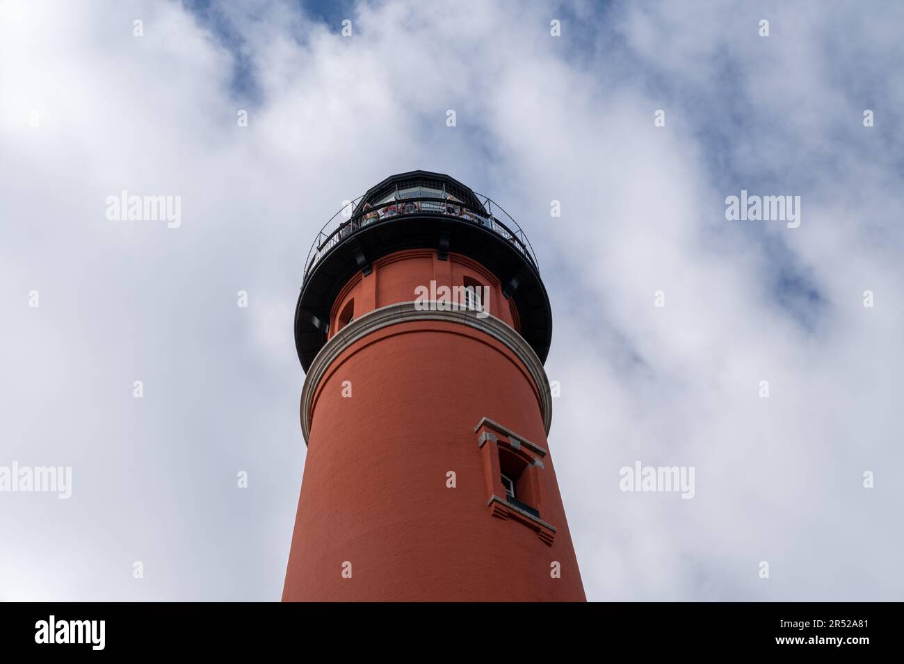 Ponce Inlet Lighthouse in Florida on a partly cloudy day. View of the ...