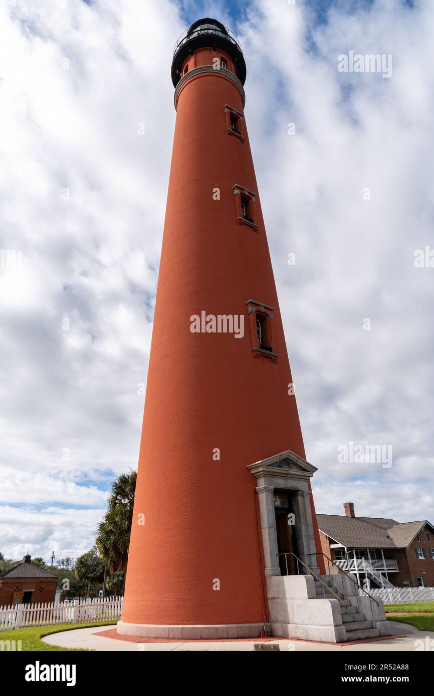 Ponce Inlet Lighthouse in Florida on a partly cloudy day. View of the ...