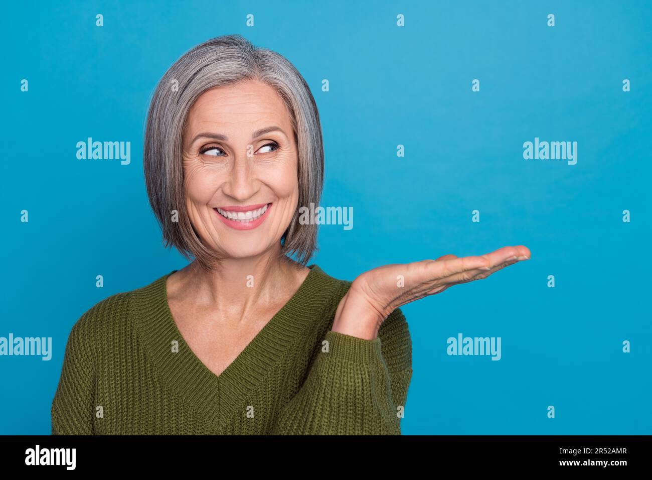 Close up photo of funny retired lady hold open palm ads interesting ...