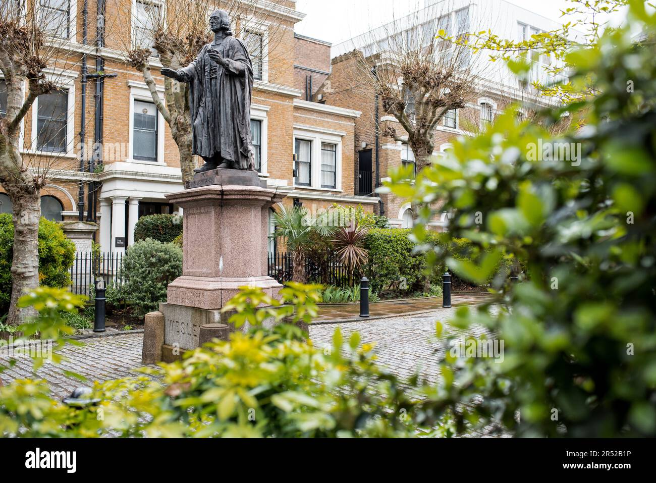 Statue of the John Wesley in the front of the John Wesley's House and ...