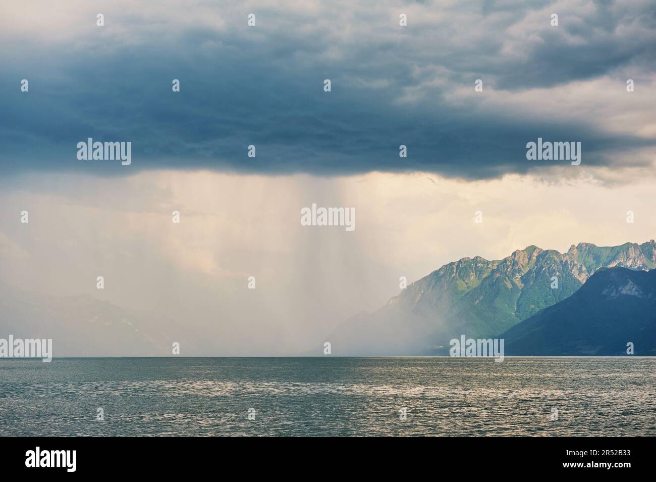 Beautiful landscape with rain over Alps and lake Geneva Stock Photo - Alamy