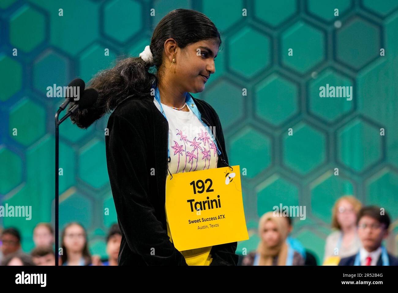 Tarini Nandakumar, 12, from Round Rock, Texas, returns to her seat as ...