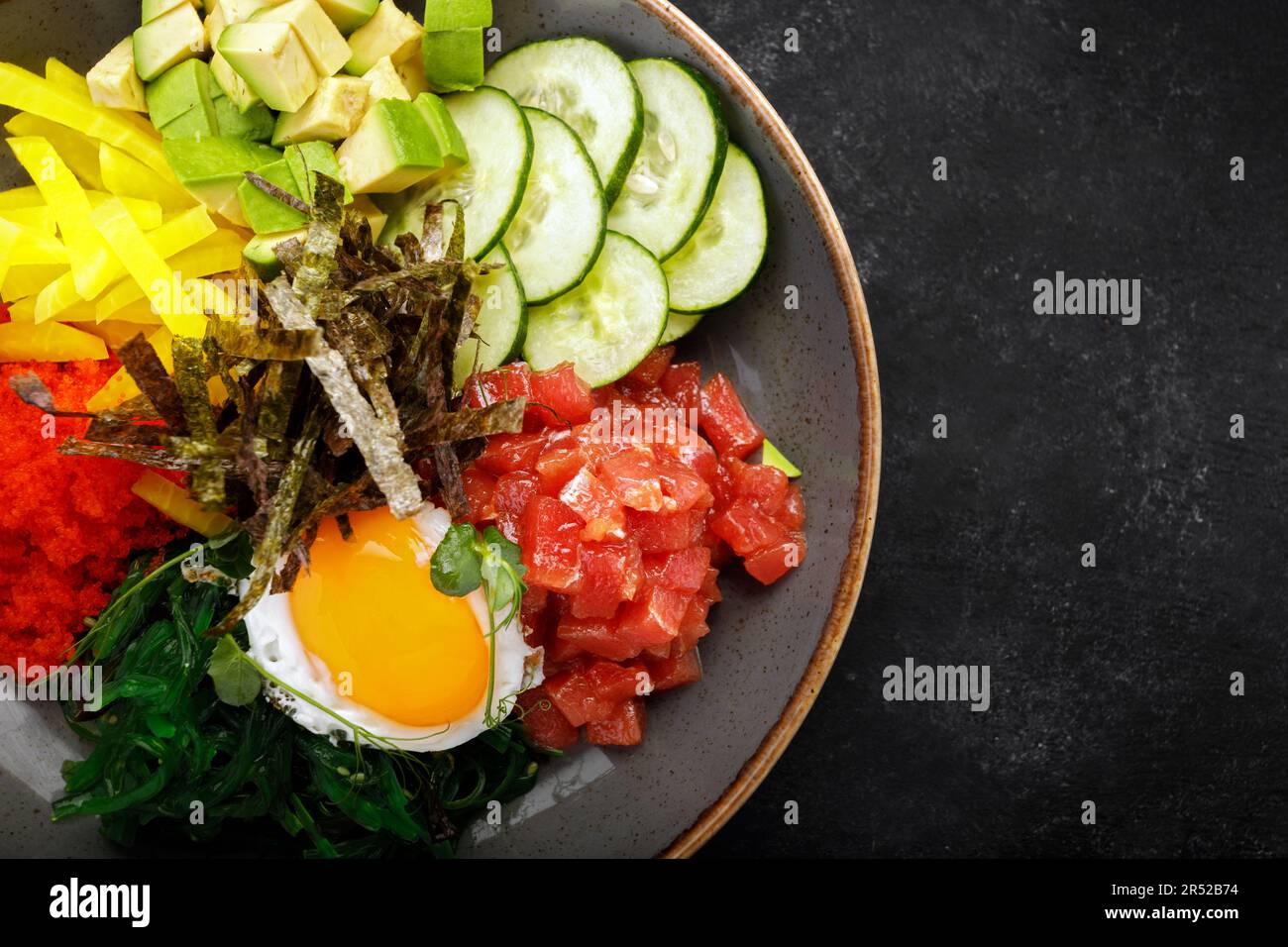seaweed-infused pibimpap with flying fish roe, meat, fish, and nori ...